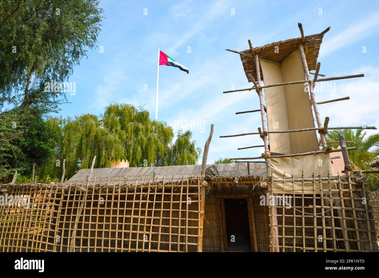 An example of a local village fishing house, home. UAE flag in the ...