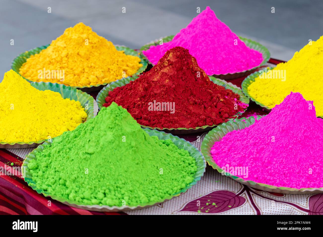 Heaps of colorful powder paints arranged in plates during holi festival ...