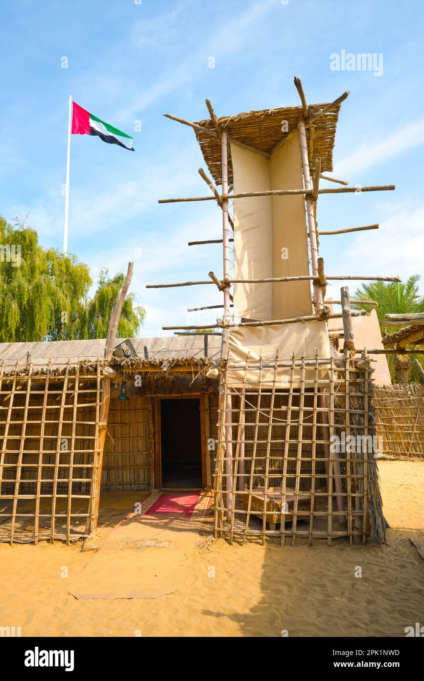 An example of a local village fishing house, home. UAE flag in the ...