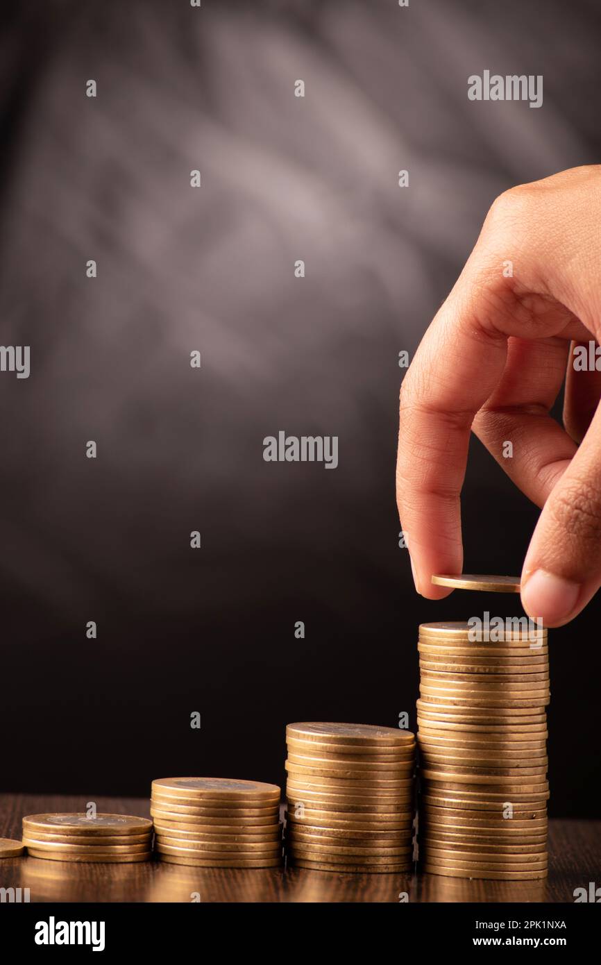 Hand holding putting coin hi-res stock photography and images - Alamy