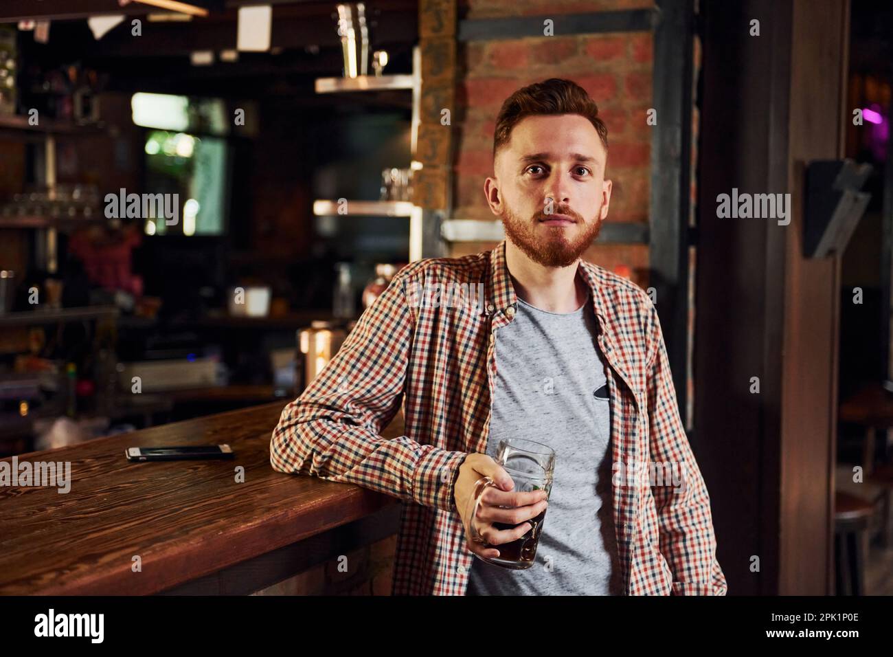 Weekend relax. Man in casual clothes sitting in the pub Stock Photo - Alamy