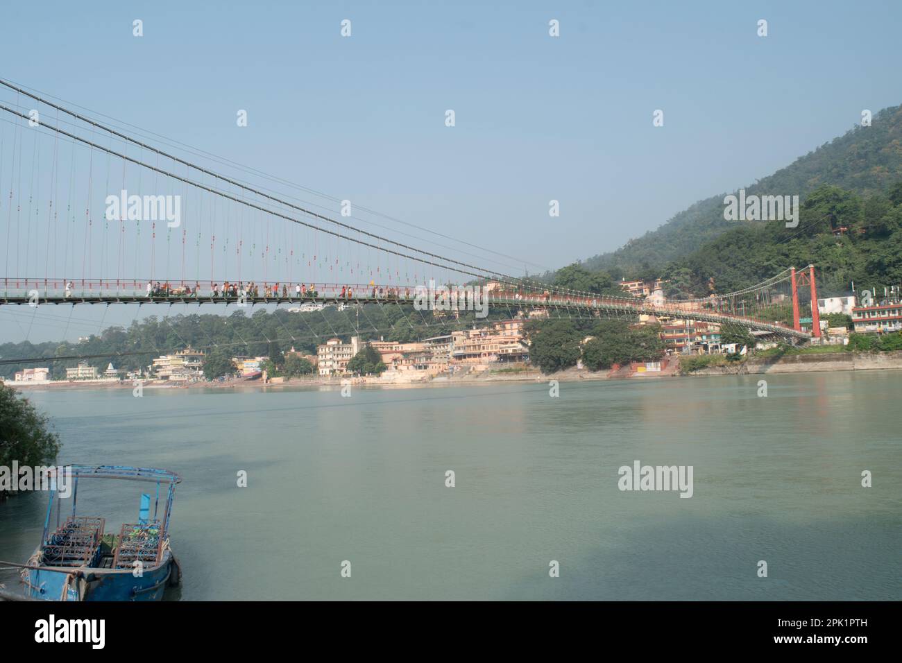 Ram jhula bridge view with holy ganga and mountain at rishikesh Stock ...