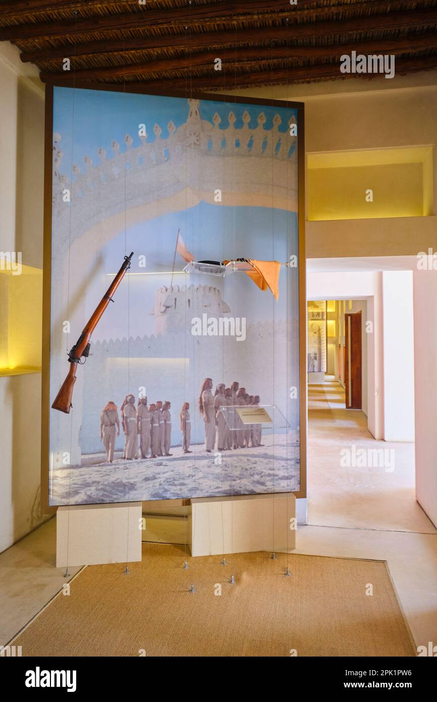 A large photograph of a guard formation and an example of a rifle and ...