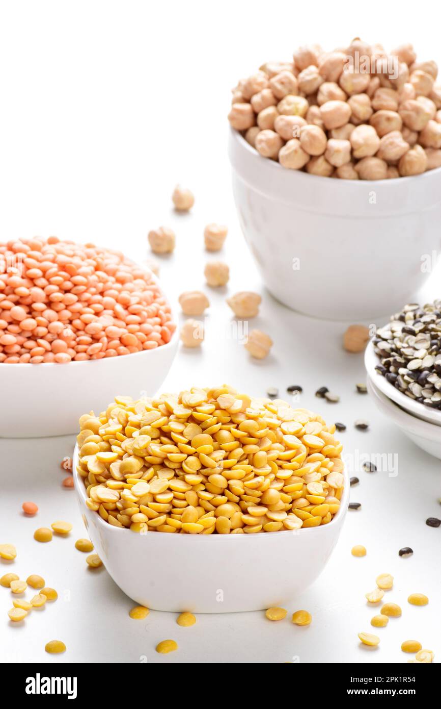 Bowl of raw chana dal on white background Stock Photo - Alamy