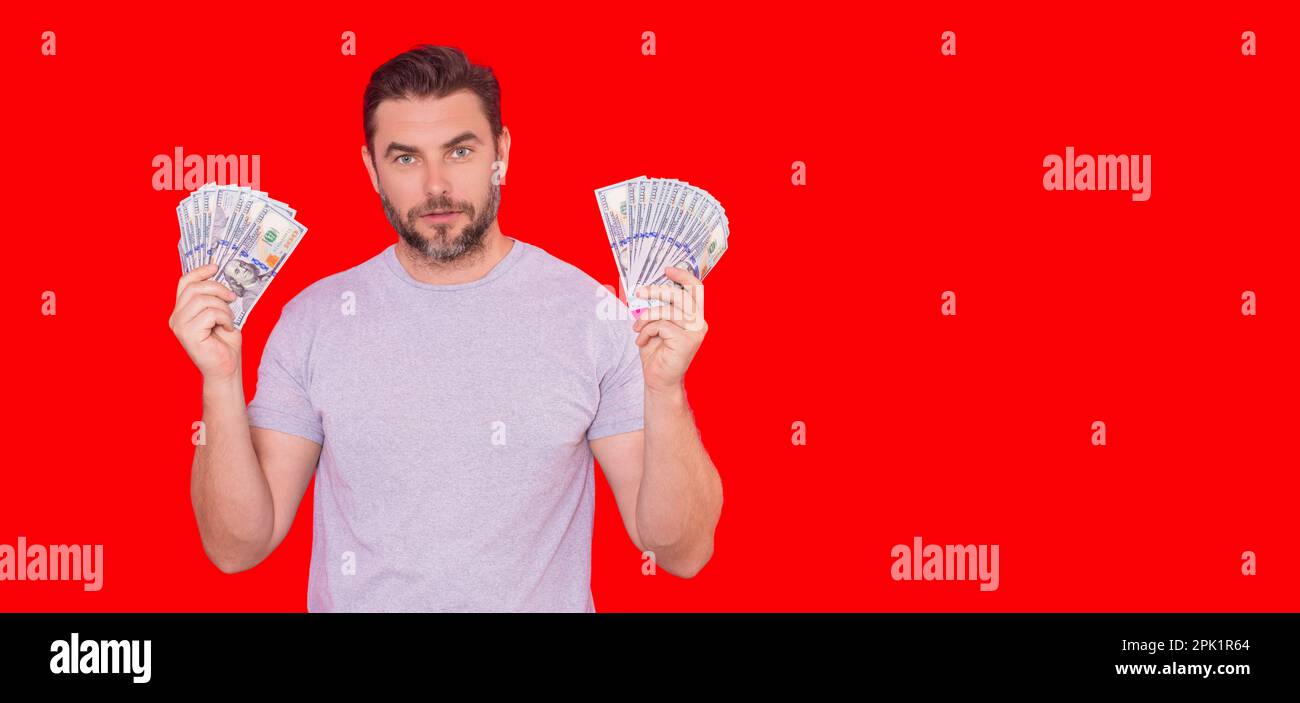 American man with money cash. Dollar banknotes. Portrait of man holding ...