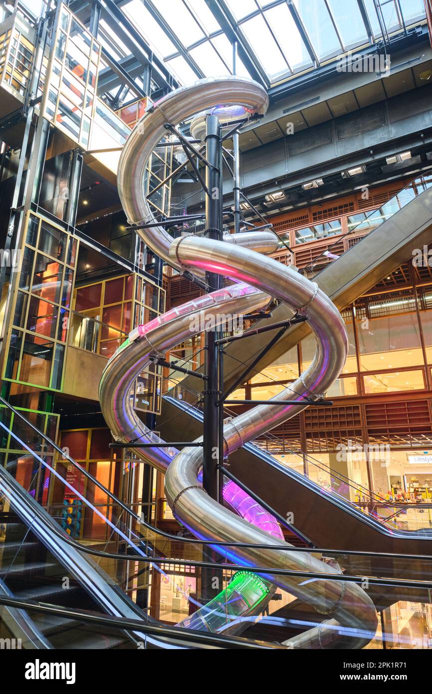 View of the twisting metal pipe ride, entertainment that fills a skylit ...