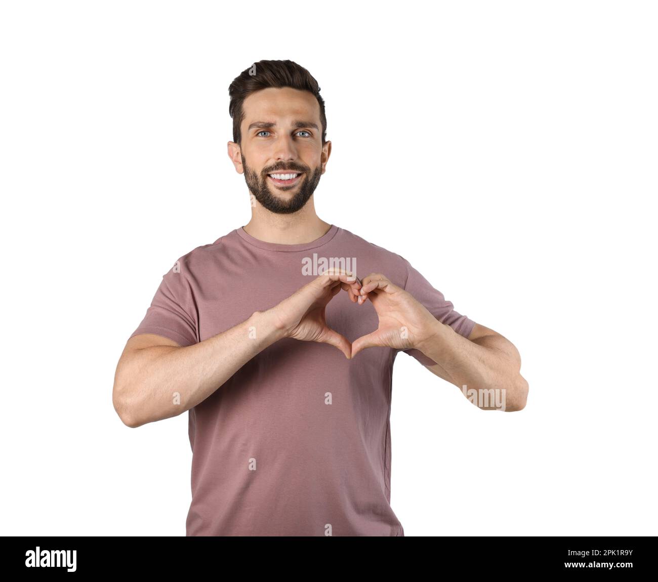 Happy man making heart with hands on white background Stock Photo - Alamy