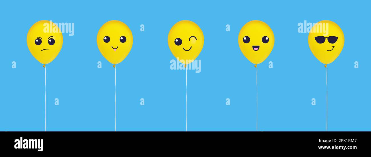 Set of balloons with different emoticons on light blue background ...