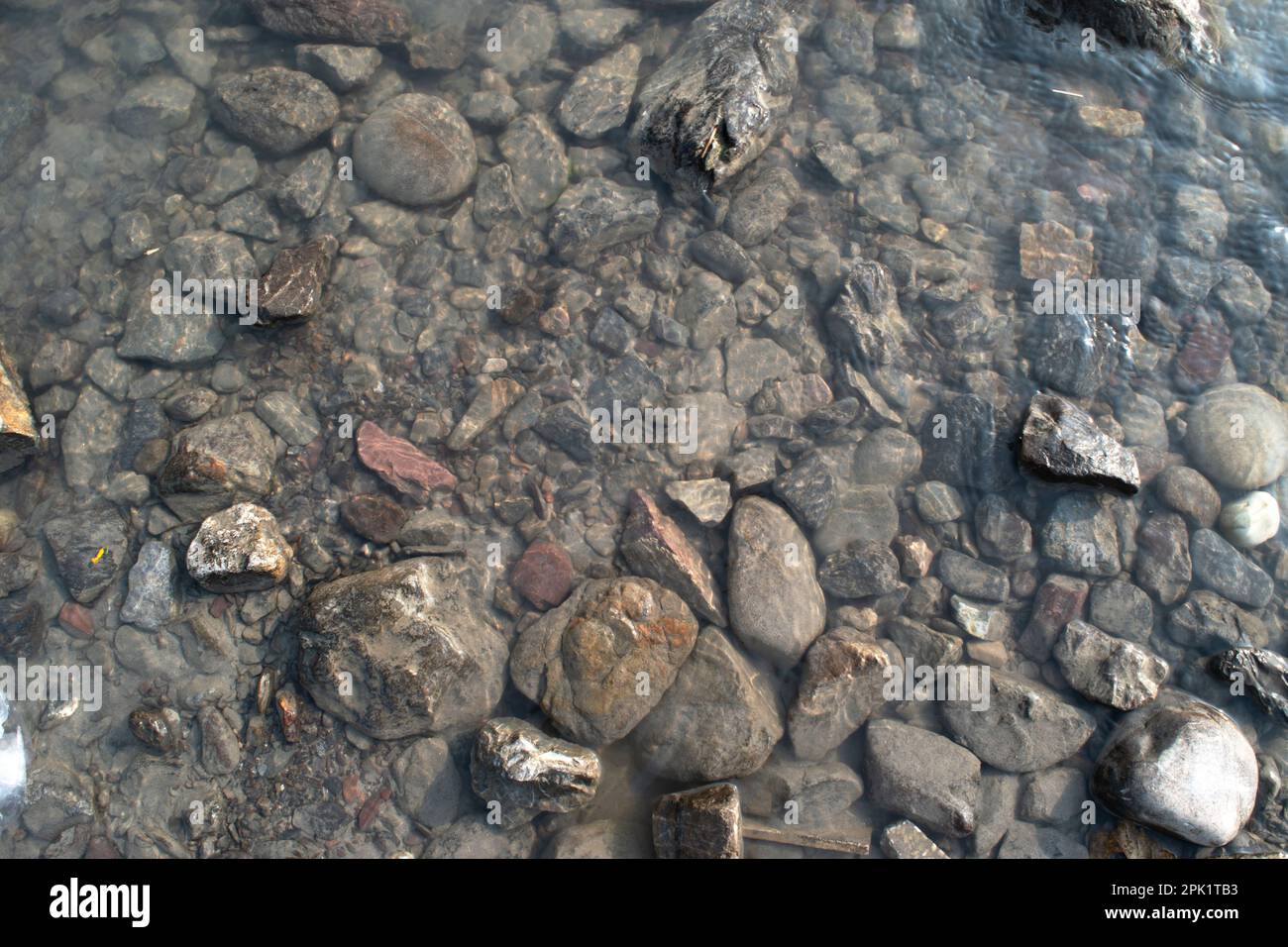 Top view of stones in water texture bckground Stock Photo - Alamy