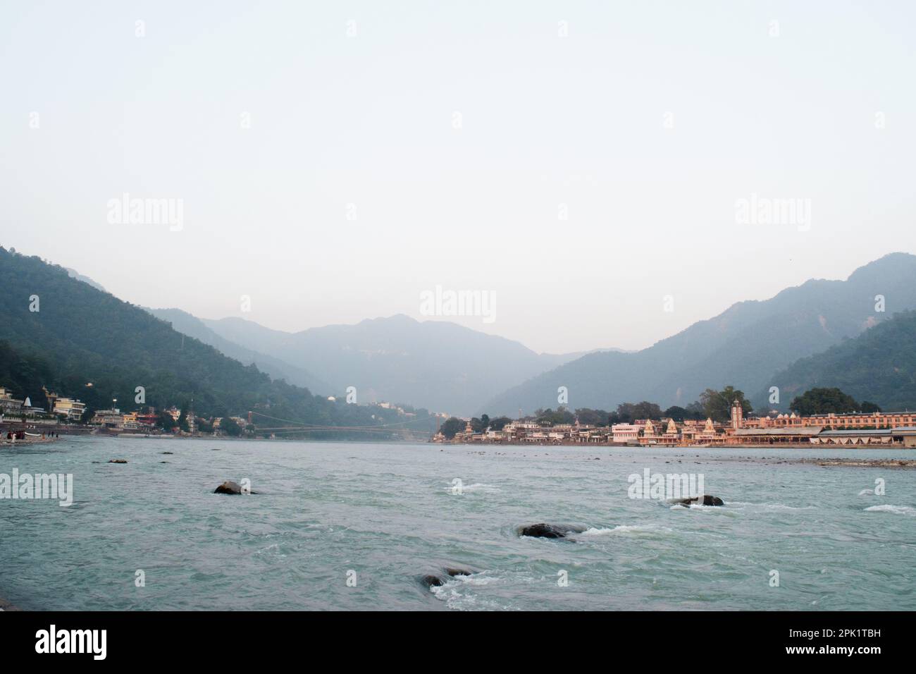 Foggy view of holy river ganga with mountains at rishikesh, uttarakhand ...