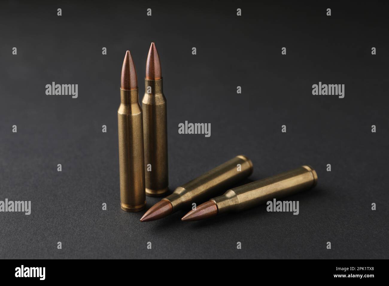 Many bullets on black background, closeup. Firearm ammunition Stock ...