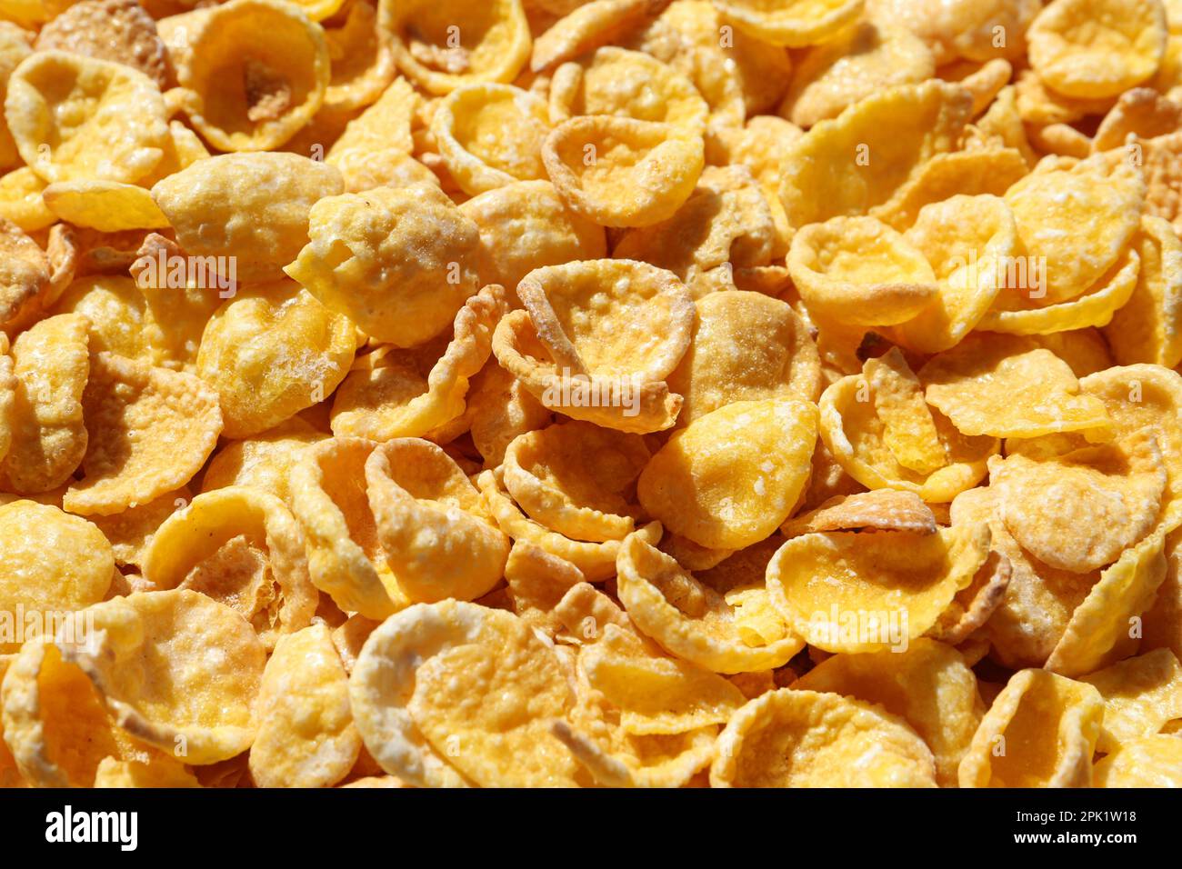 Crispy corn flakes as background, closeup view Stock Photo - Alamy