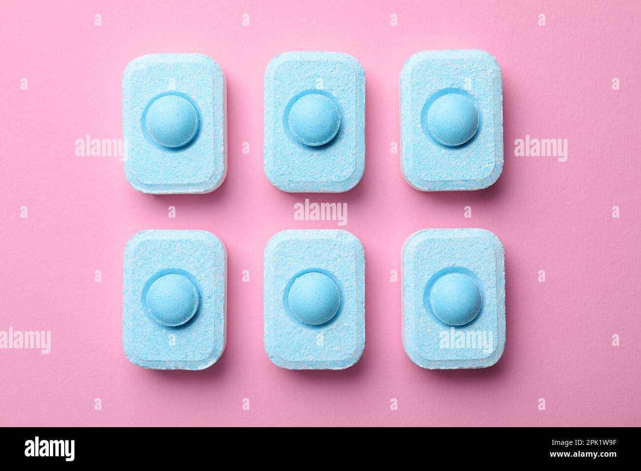 Water softener tablets on pink background, flat lay Stock Photo - Alamy