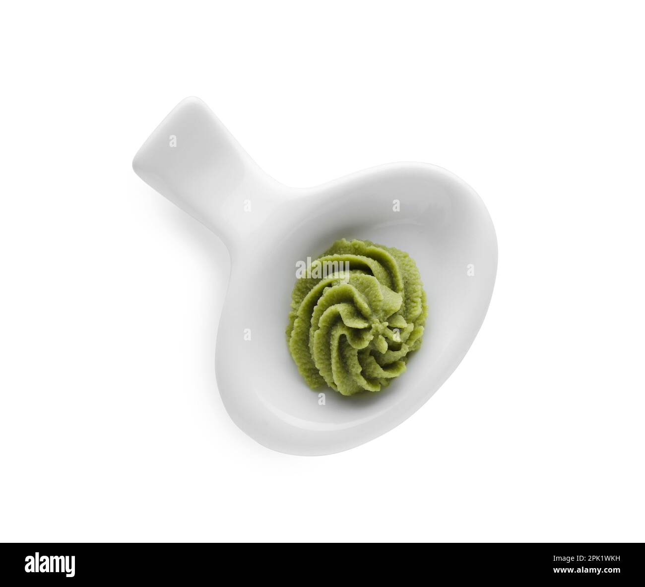 Plate with swirl of wasabi paste isolated on white, top view Stock ...