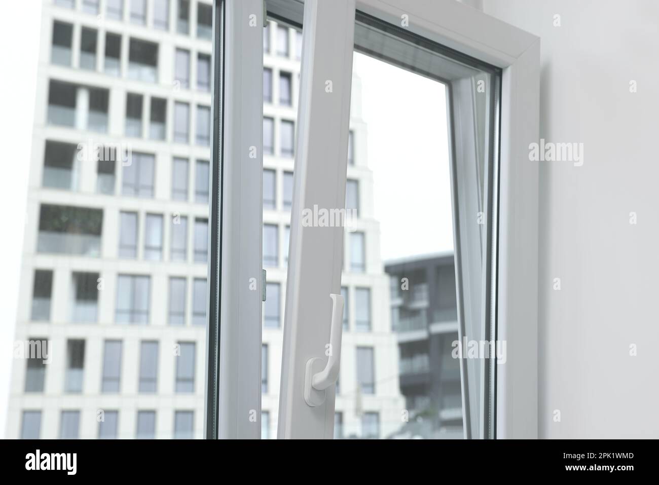 Open window with white plastic frame indoors Stock Photo - Alamy