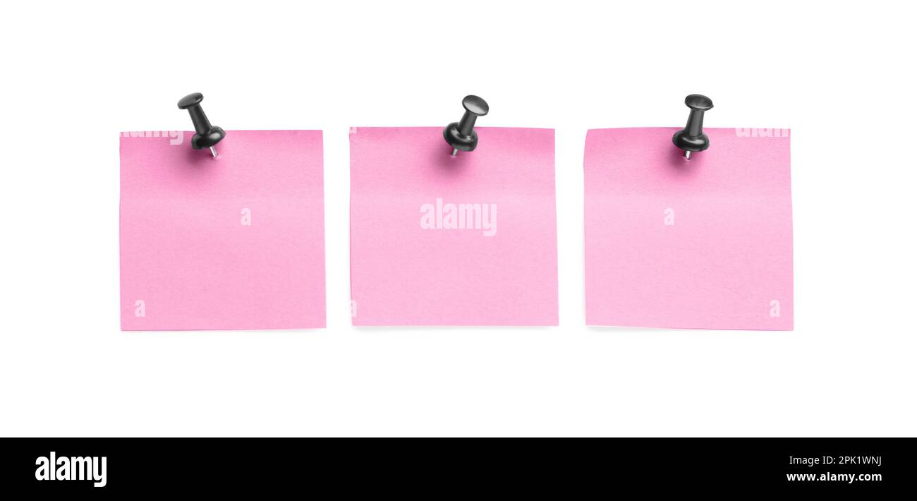 Blank pink notes with black pins on white background, top view. Space ...