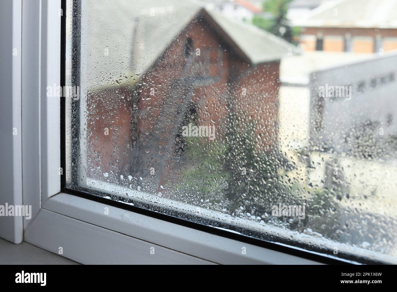 Wet window on rainy day, closeup. View from inside Stock Photo - Alamy