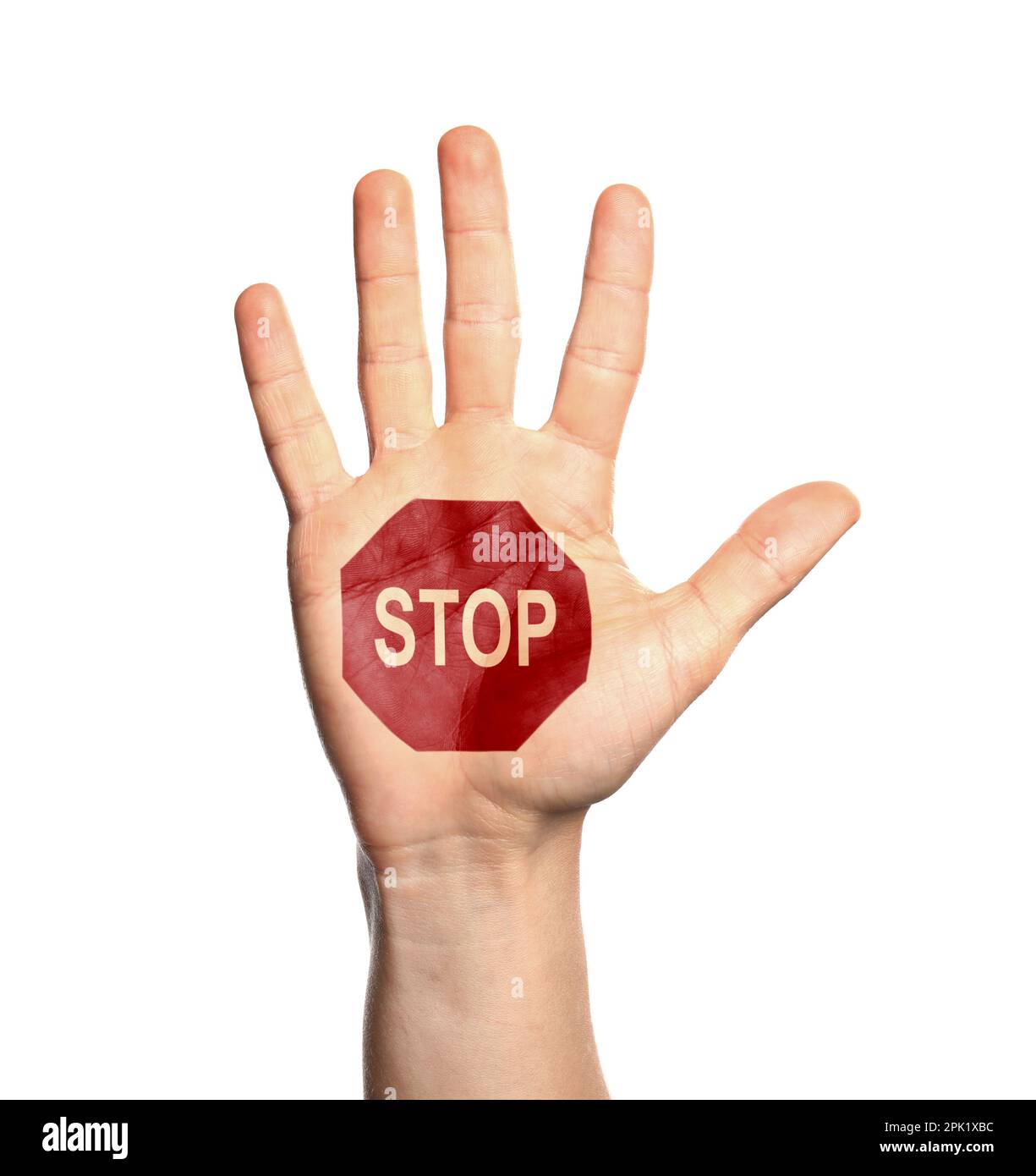 Woman showing palm with drawn STOP sign on white background, closeup ...
