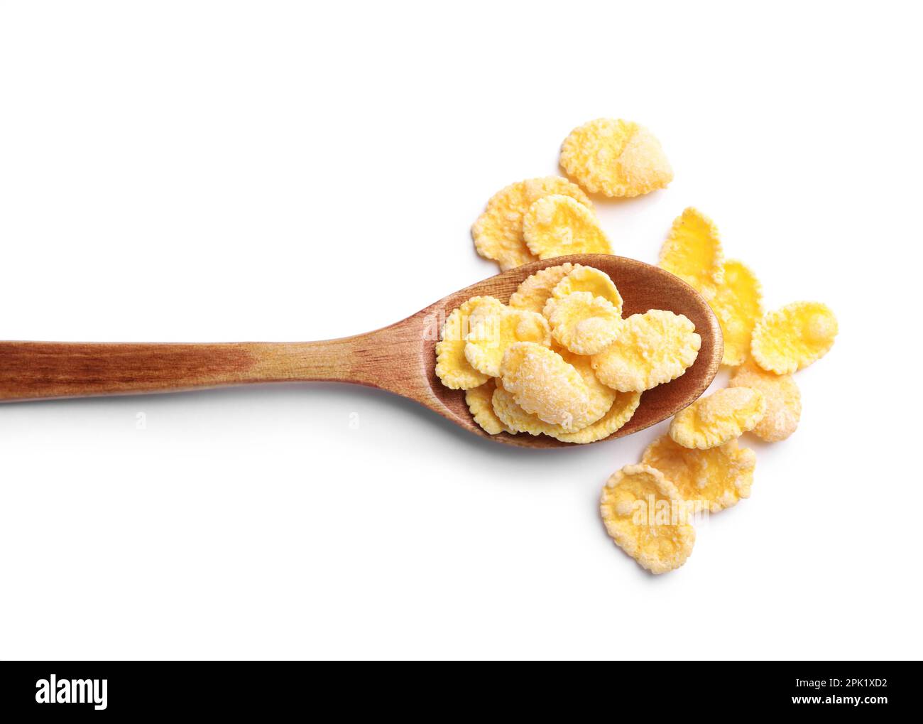 Wooden spoon of tasty crispy corn flakes on white background, top view ...