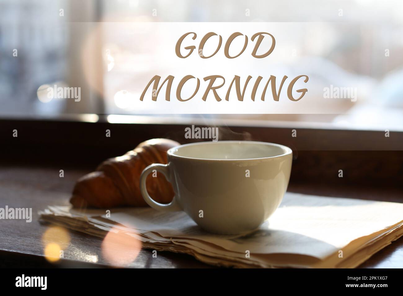Good Morning! Delicious coffee, newspaper and croissant near window ...