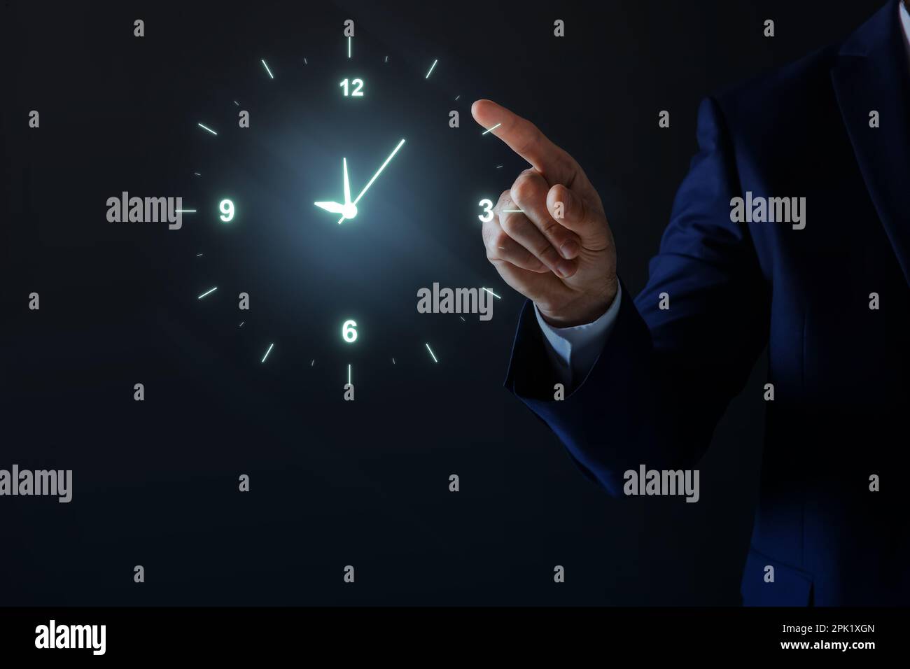 Man holding virtual icon of clock on dark background, closeup. Time ...