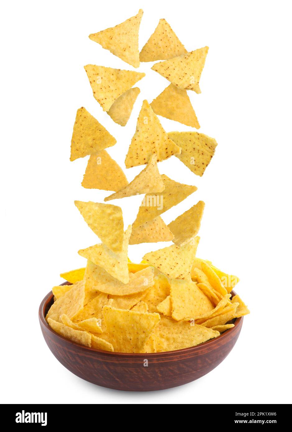 Tasty tortilla chips (nachos) falling into bowl on white background ...