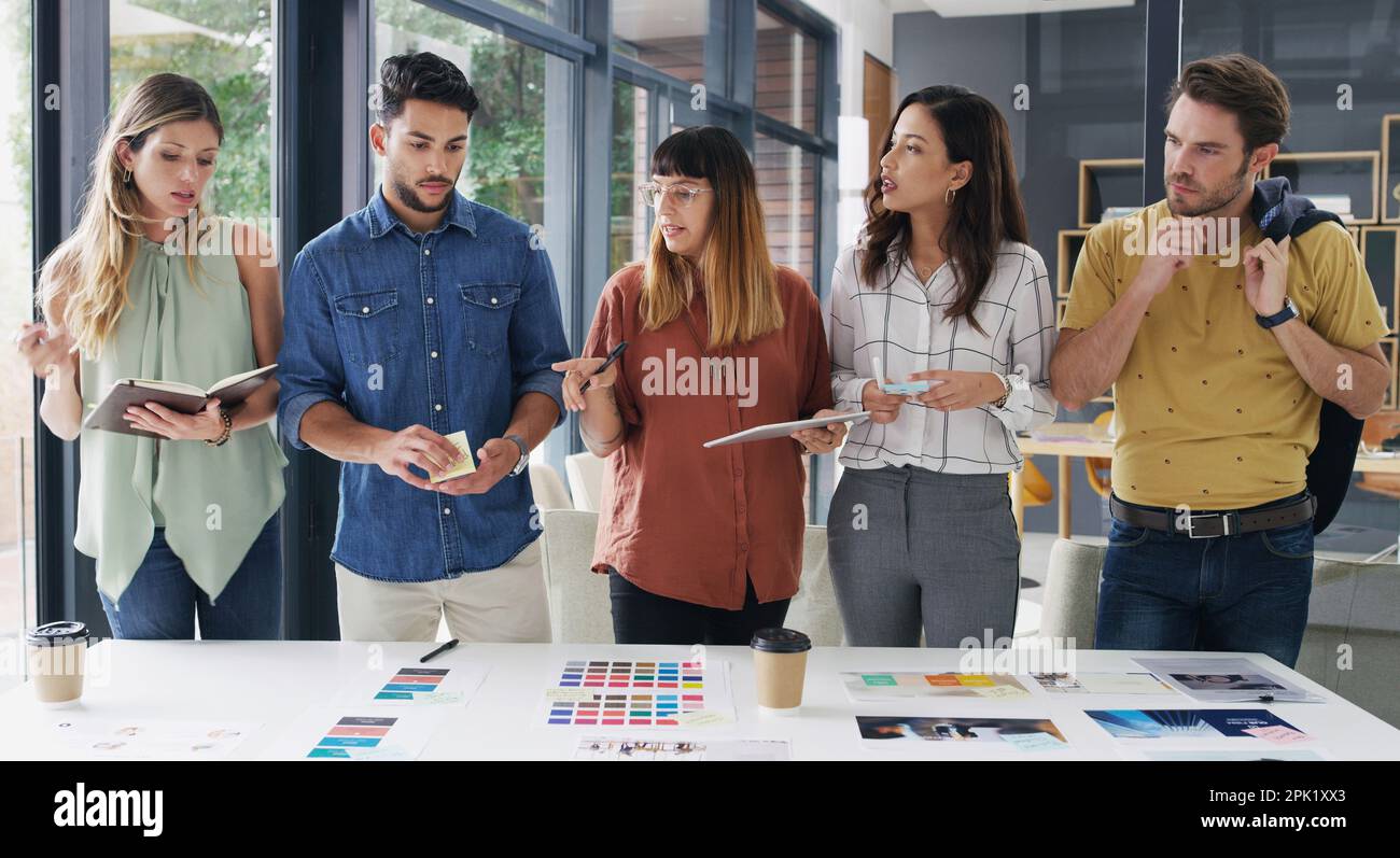 They always aim high as a team. a group of designers brainstorming ...
