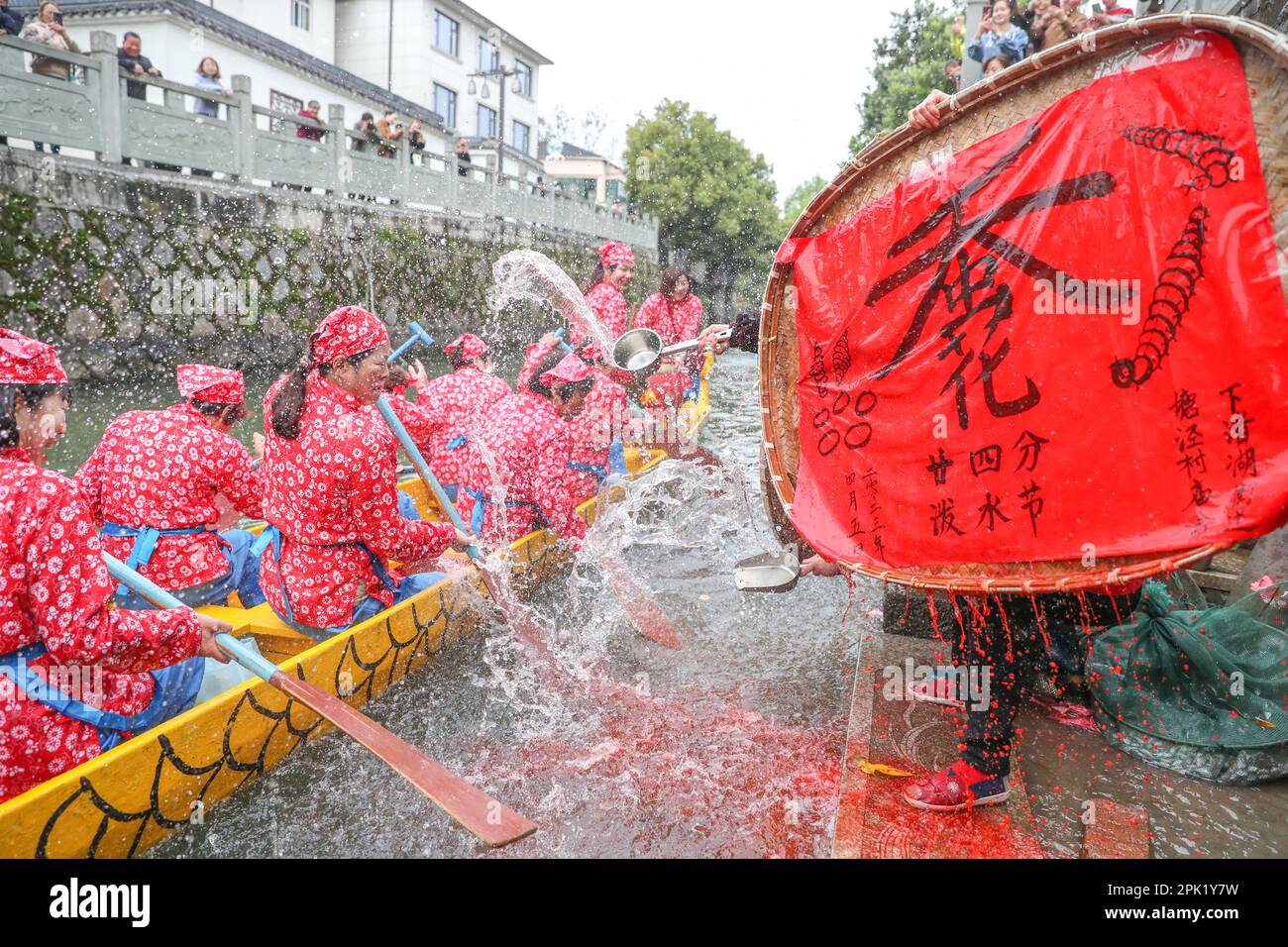 HUZHOU, CHINA - APRIL 5, 2023 - Silkworm women use paddles to pour ...