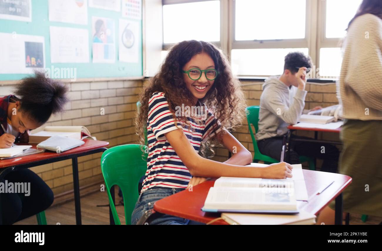 Shes gonna ace the exams. Portrait of a cheerful young school kid ...