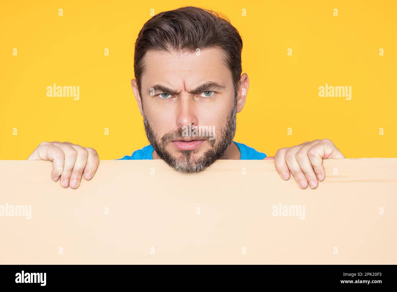 Information concept. Angry man with blank placard. Demonstrating copy ...