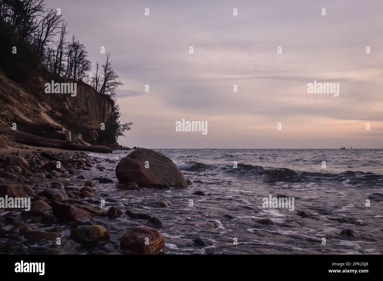 Cloudy winter seaside landscape. Beach with a cliff over the Baltic Sea ...