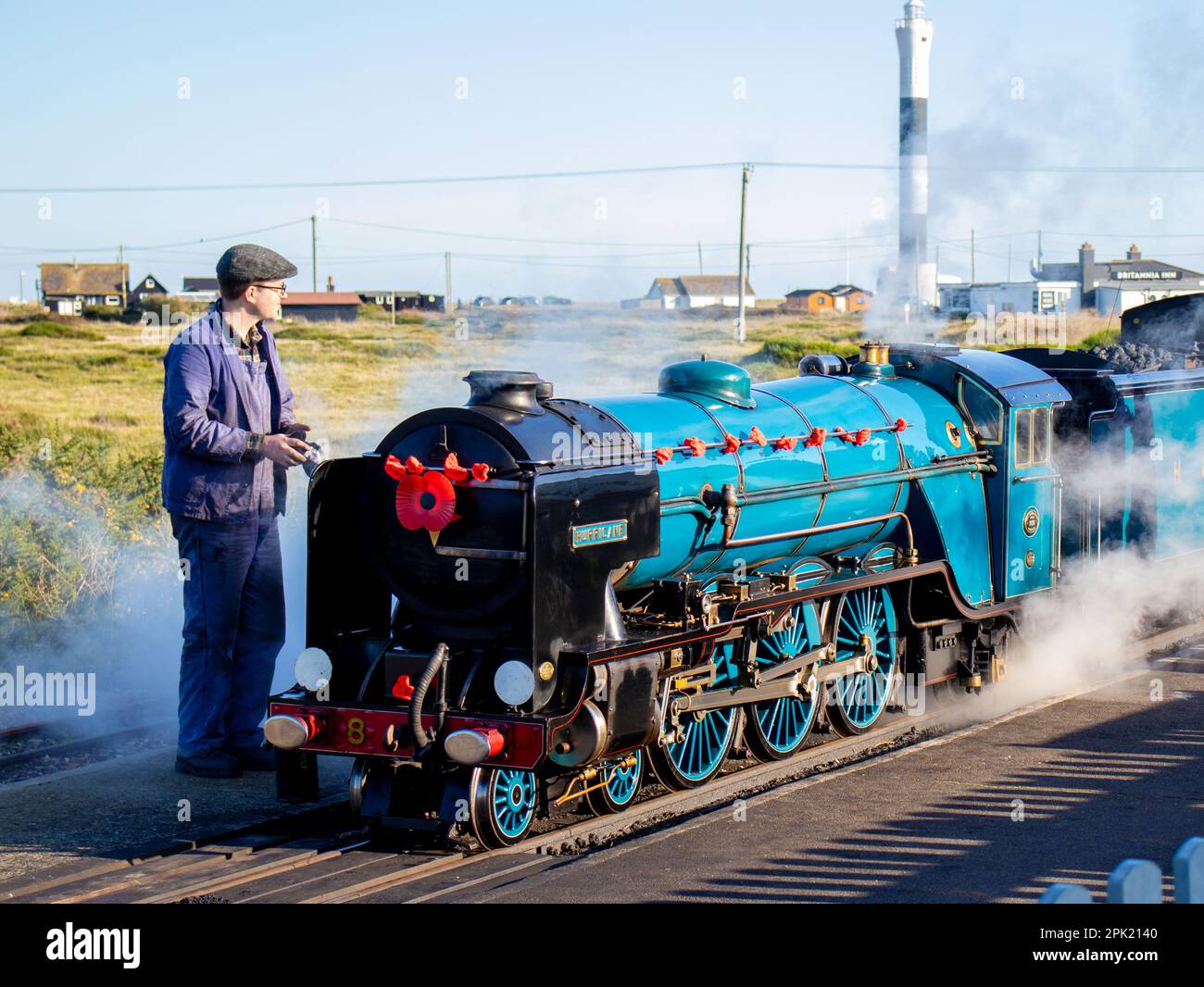 An engineer tends to the steam engine Hurricane on the Romney, Hythe ...