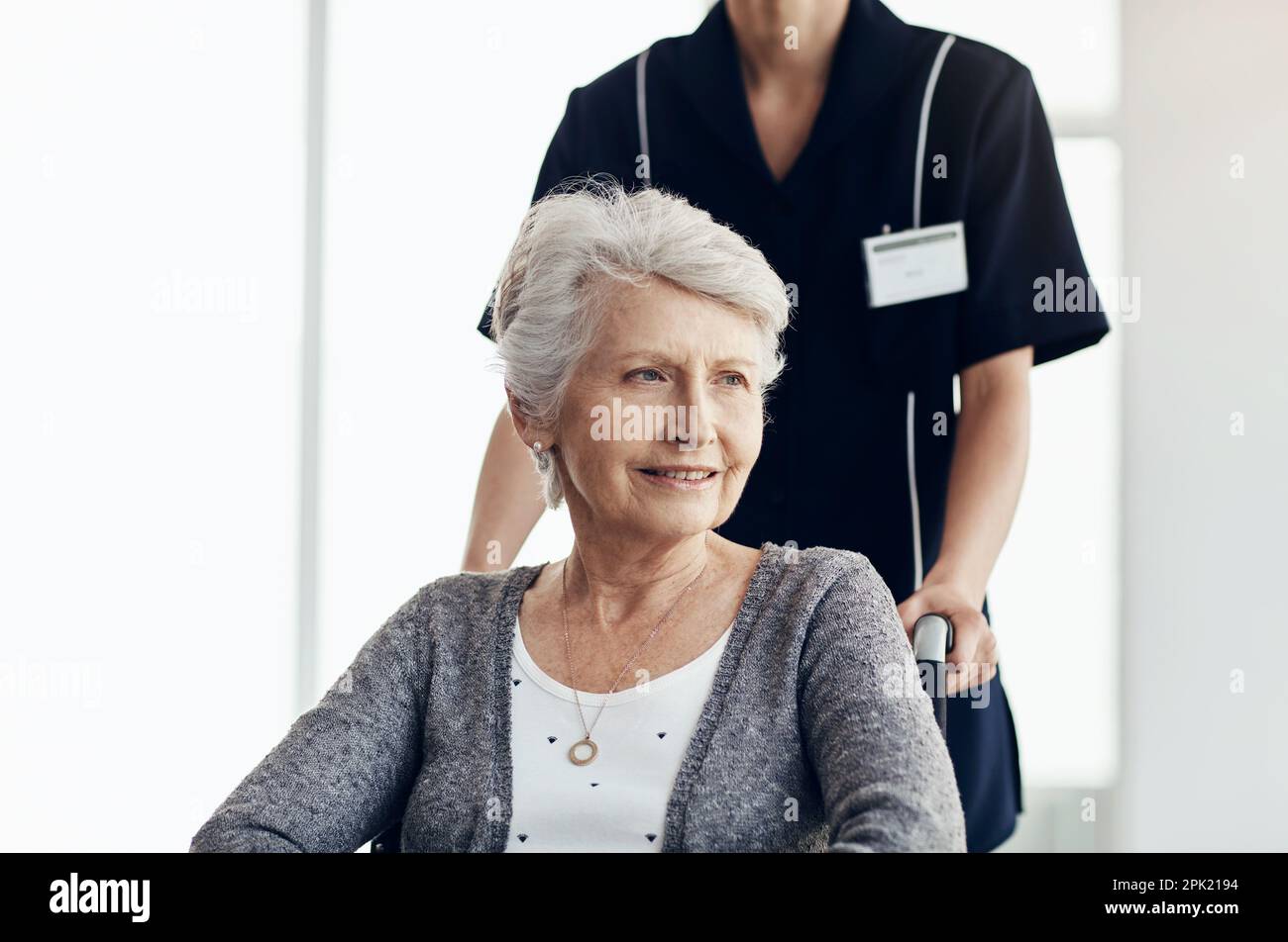 Being cared for is such a relief. a senior woman in a wheelchair being ...