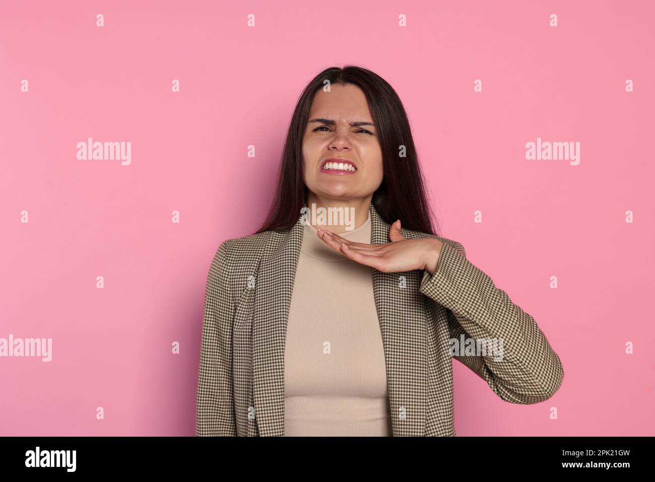 Emotional young woman on pink background. Aggression concept Stock ...