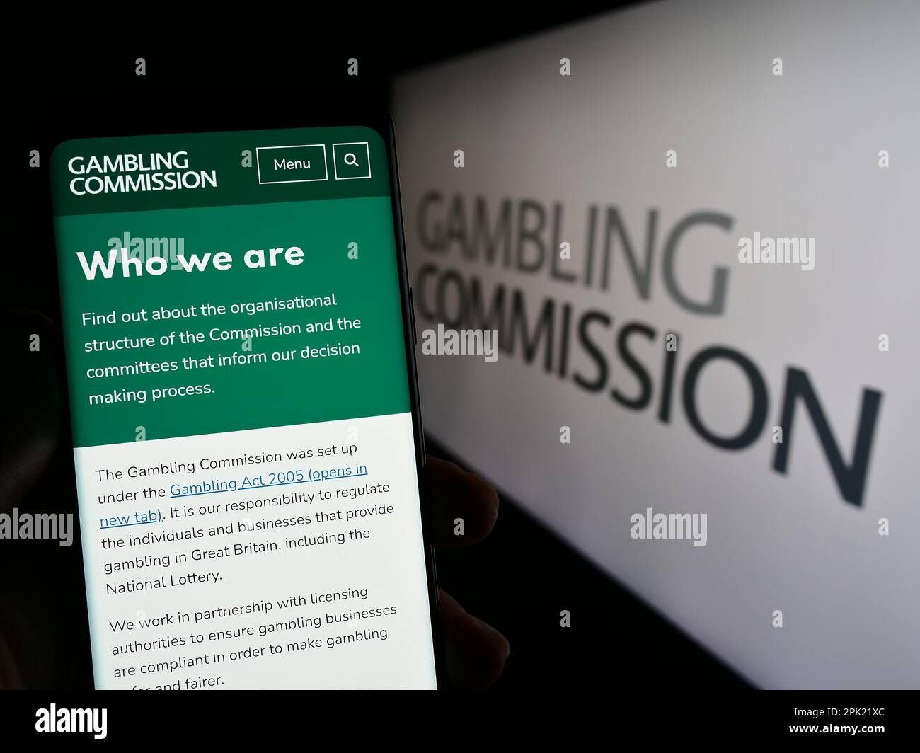 Person holding smartphone with web page of British public body Gambling ...