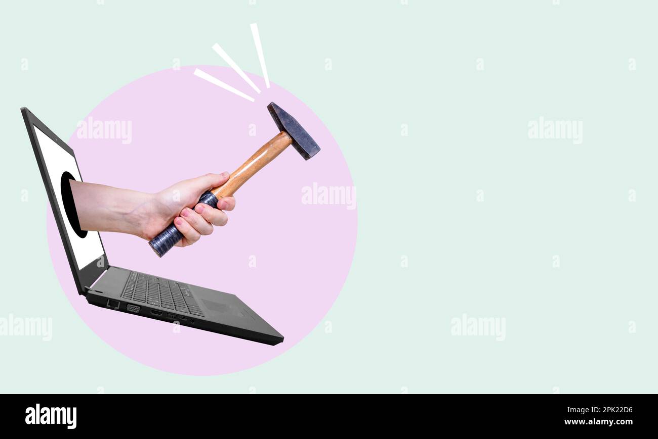 Collage art, the hand with hammer sticking out of laptop on a light ...