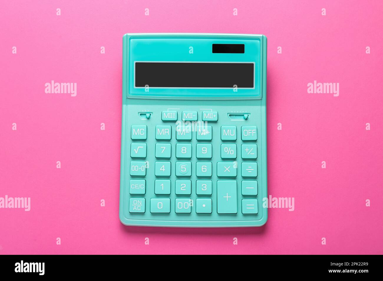 Turquoise calculator on pink background, top view Stock Photo - Alamy