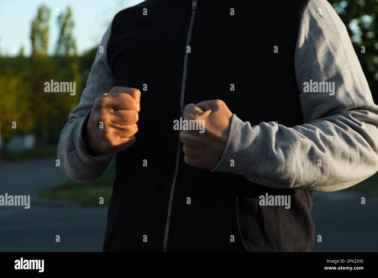 Angry man clenched fists hi-res stock photography and images - Alamy