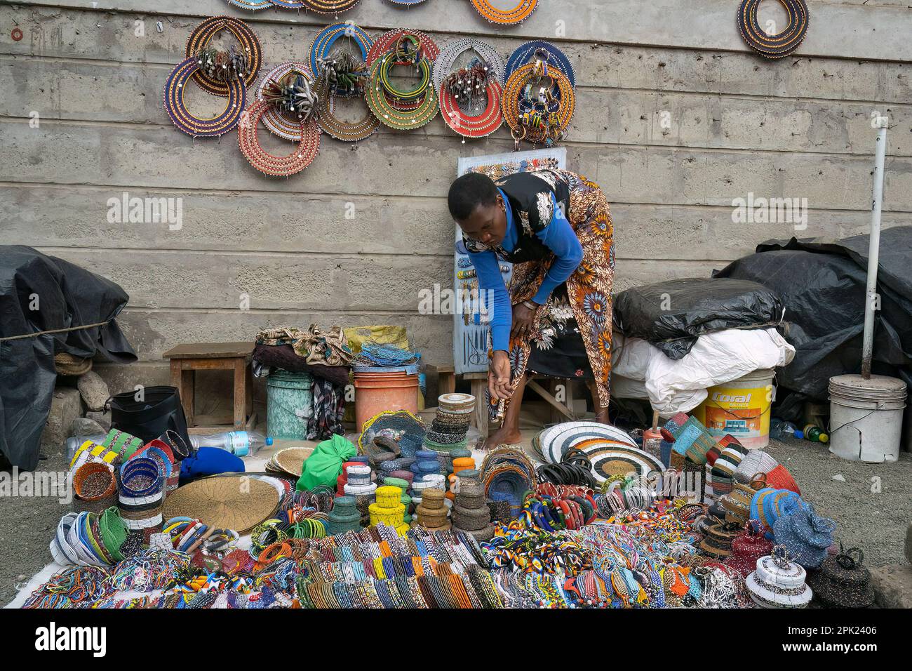 Arusha, Tanzania - October 17th, 2022: A woman selling colorful bead ...