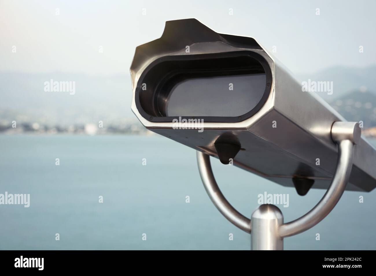 Metal tower viewer installed near sea, space for text. Mounted ...