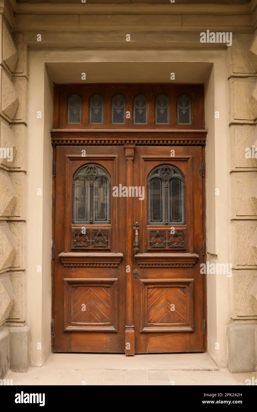 View of building with big vintage wooden door. Exterior design Stock ...