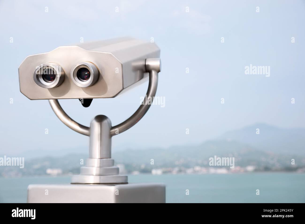 Metal tower viewer installed near sea, space for text. Mounted ...