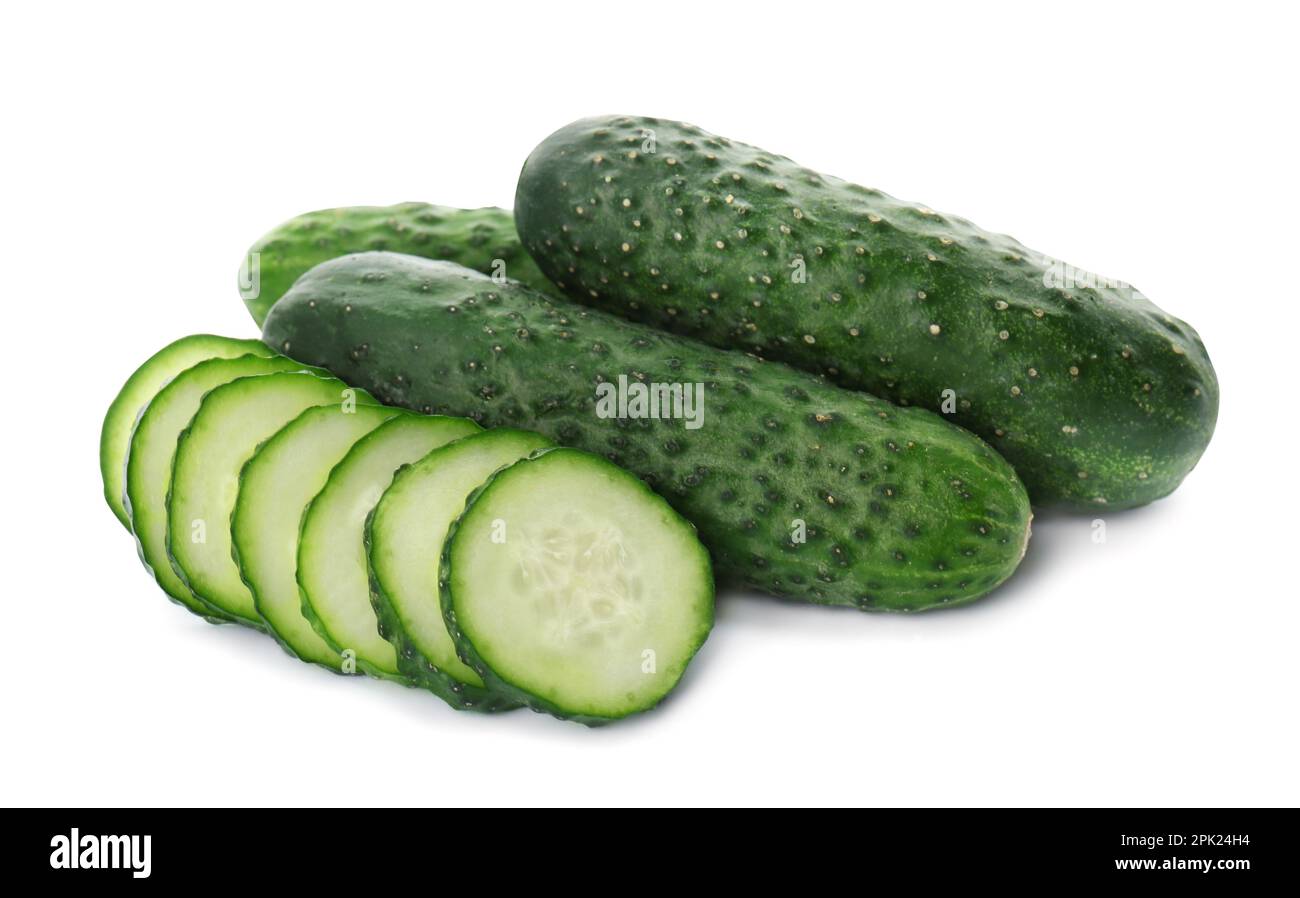 Whole and cut cucumbers on white background Stock Photo - Alamy