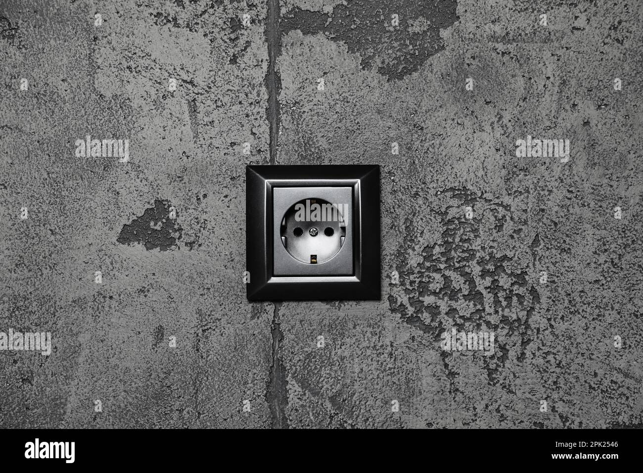 Power socket on grey wall. Electrical supply Stock Photo - Alamy