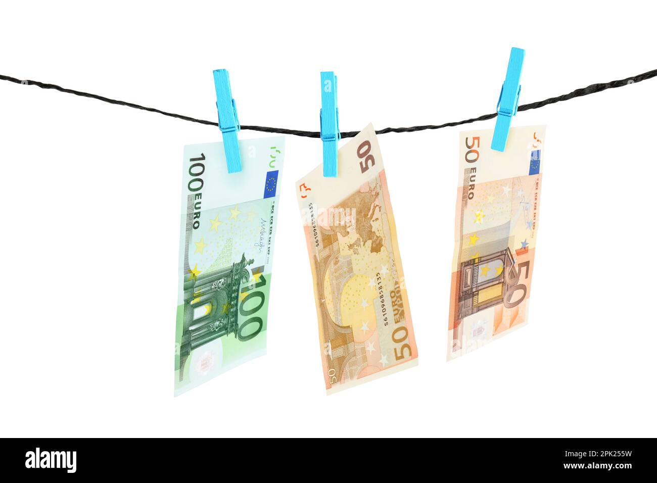Money laundering. Euro banknotes hanging on clothesline against white ...