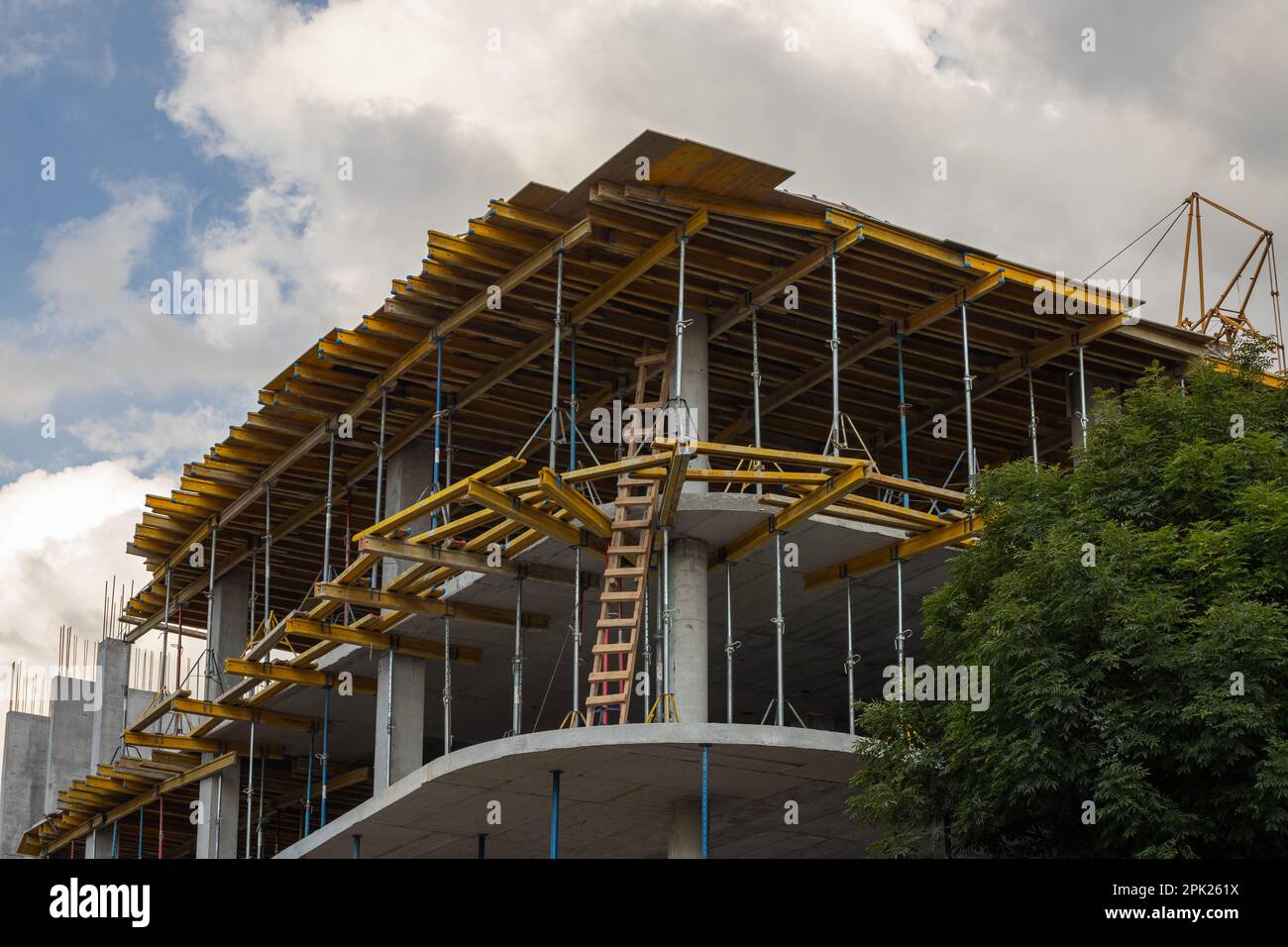 Multi-level commercial high-rise building construction with blue sky ...