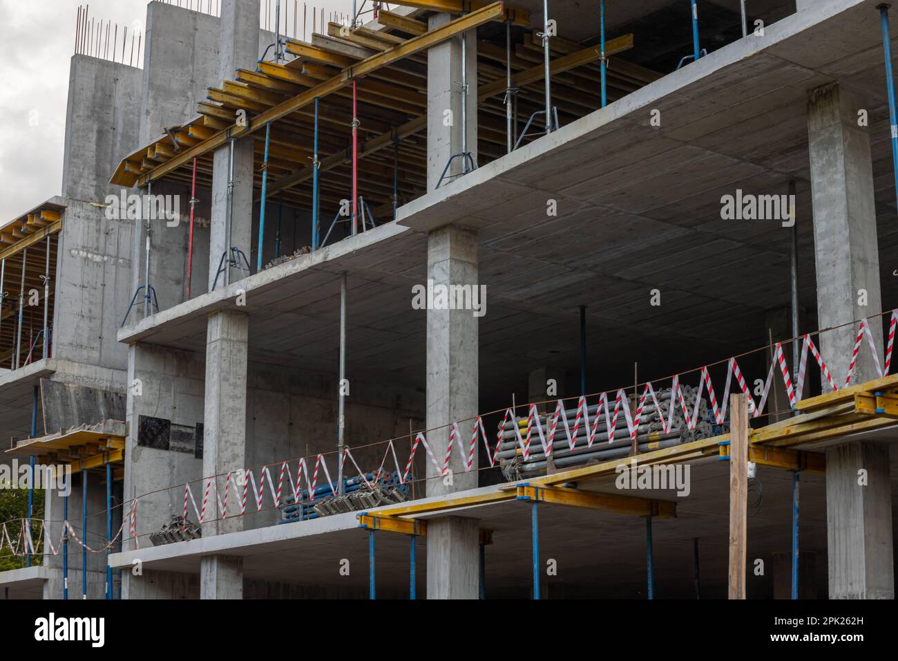 Multi-level commercial high-rise building construction with blue sky ...