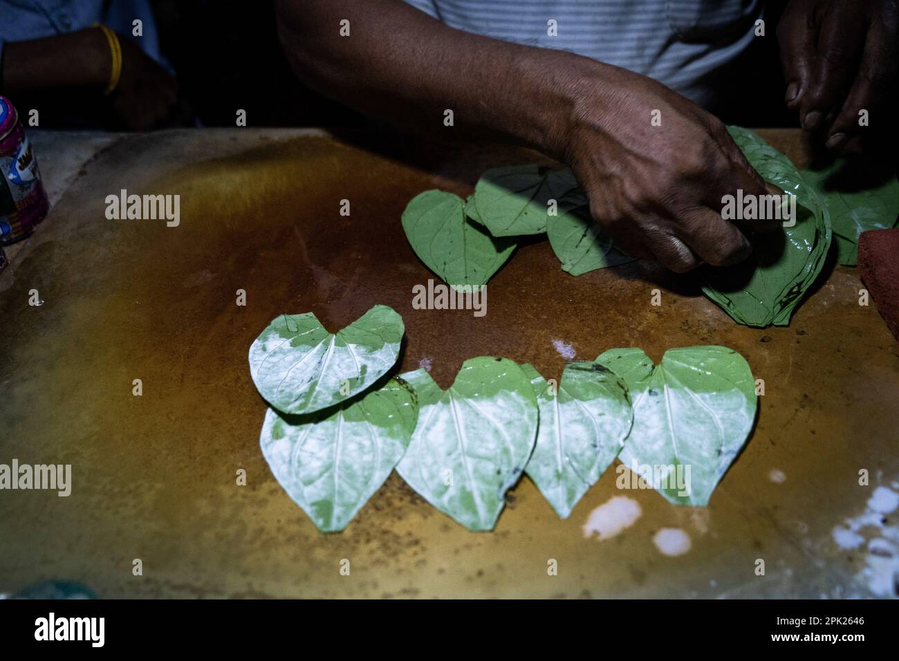 April 2, 2023, Yangon, Myanmar: A betel nut vendor prepares his product ...