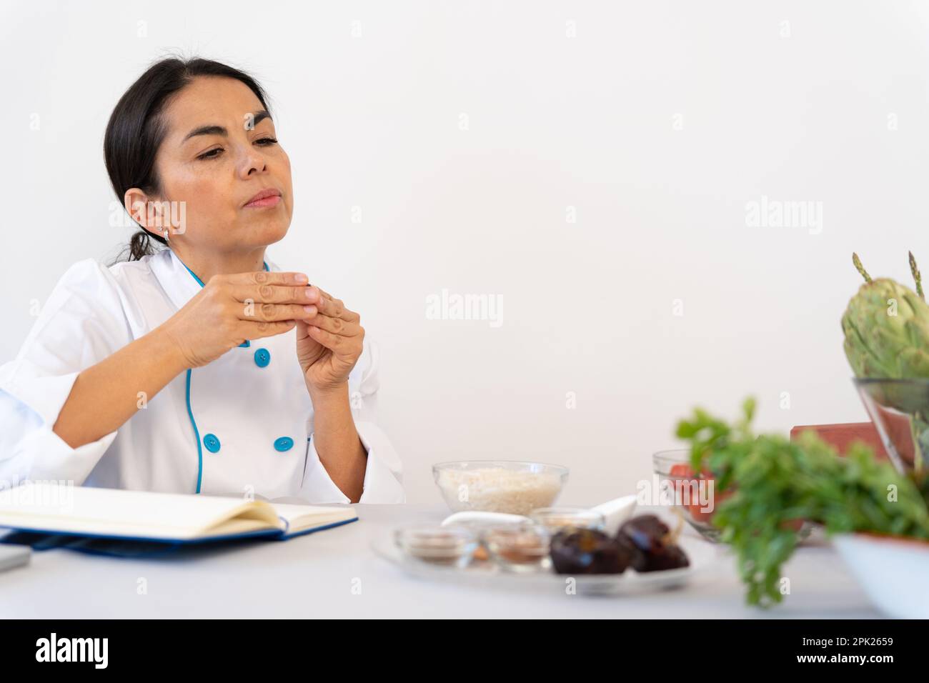 Chef doubting or pondering in the kitchen with ingredients Stock Photo ...