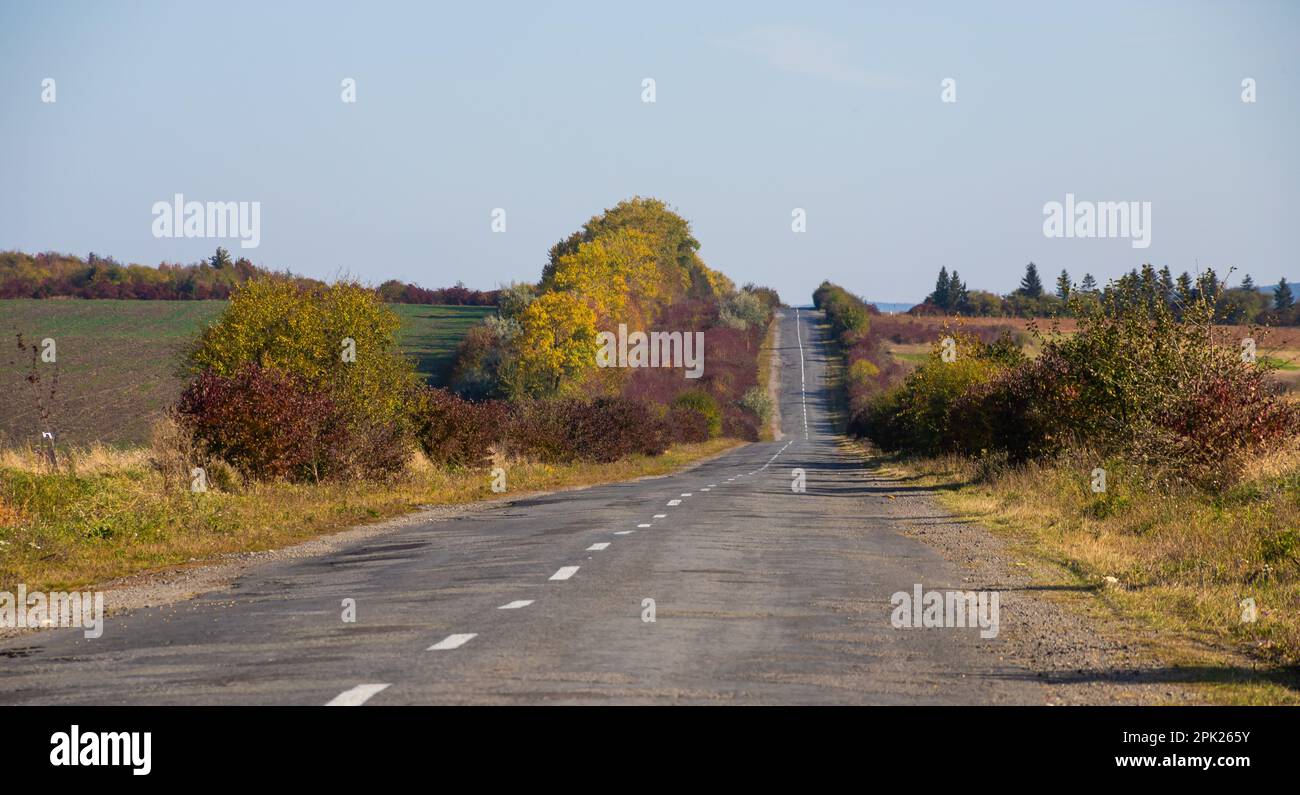 Beautiful autumn road. Autumn background. Country road made of old ...
